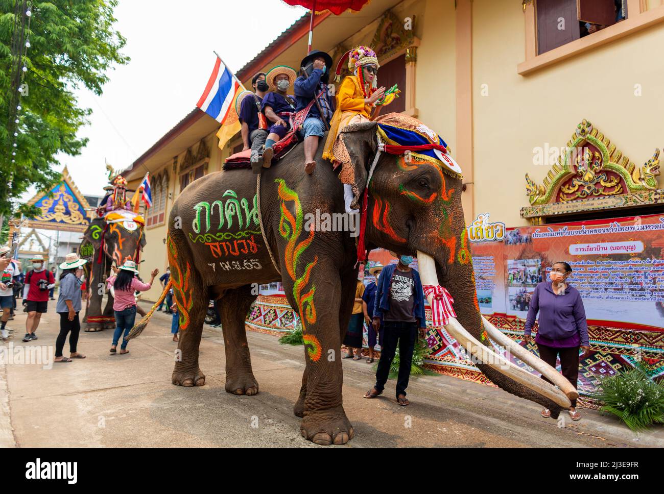 Thai Buddhists monks-to-be wearing colorful traditional costumes ride ...