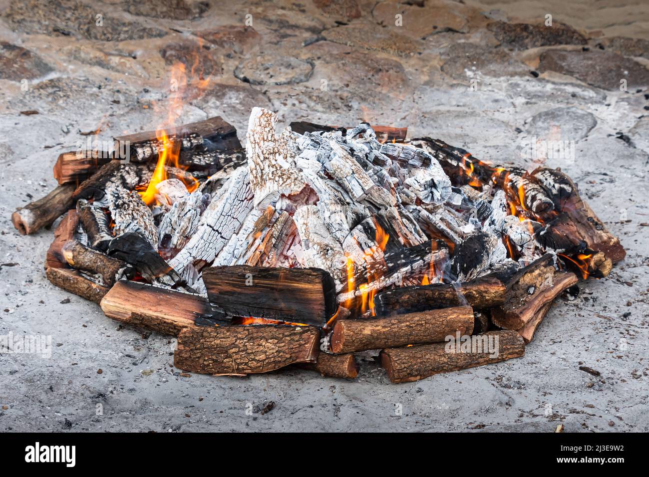 LARGE CIRCULAR BONFIRE BUILT ON THE GROUND Stock Photo - Alamy