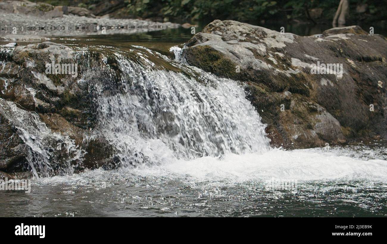Beautiful waterfall on the river in mountainous region. Creative ...