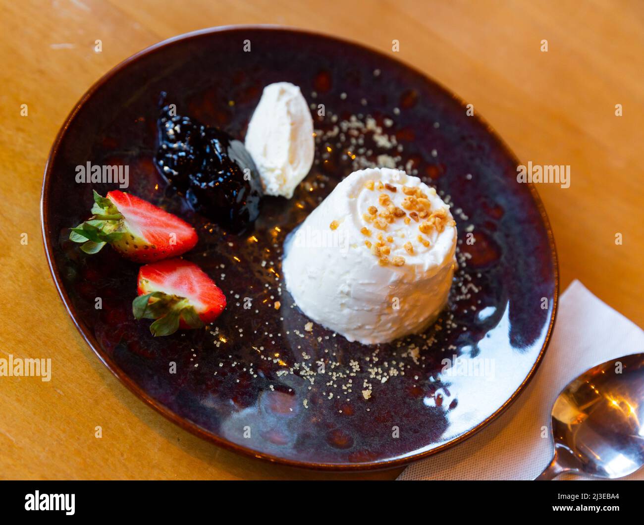 Fresh faisselle de savoie served on table with jam and strawberry Stock ...