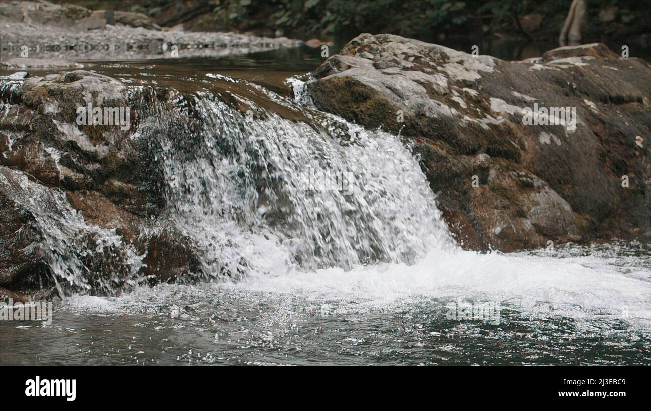 Beautiful waterfall on the river in mountainous region. Creative ...