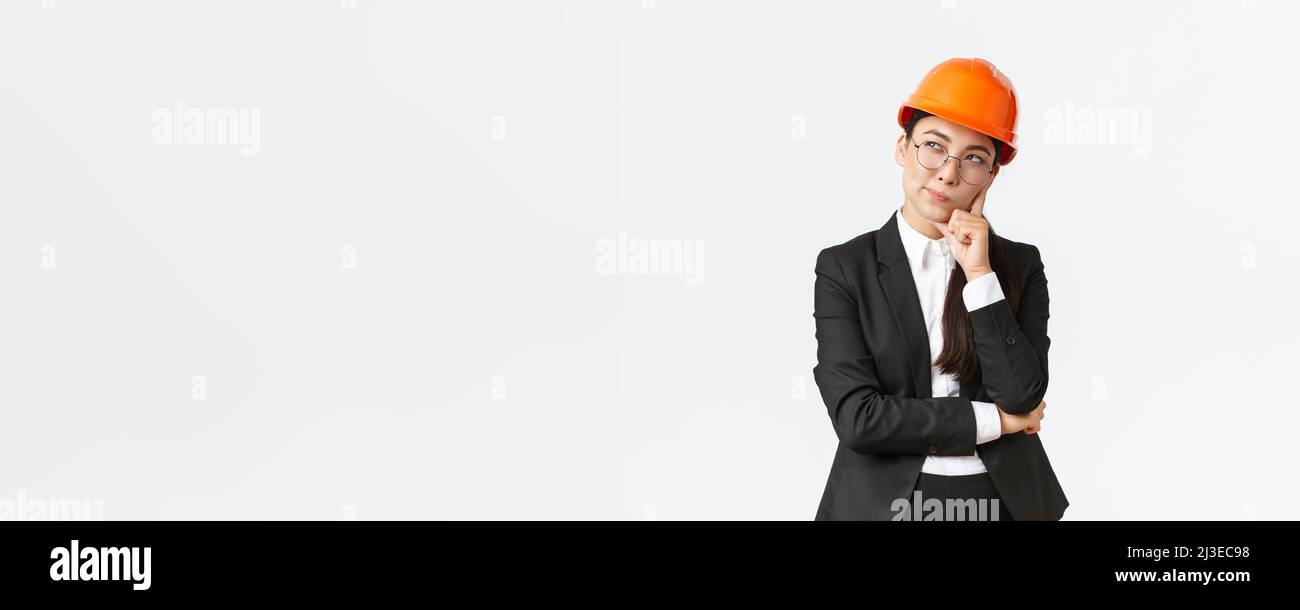 Thoughtful creative female asian chief architect, construction engineer ...
