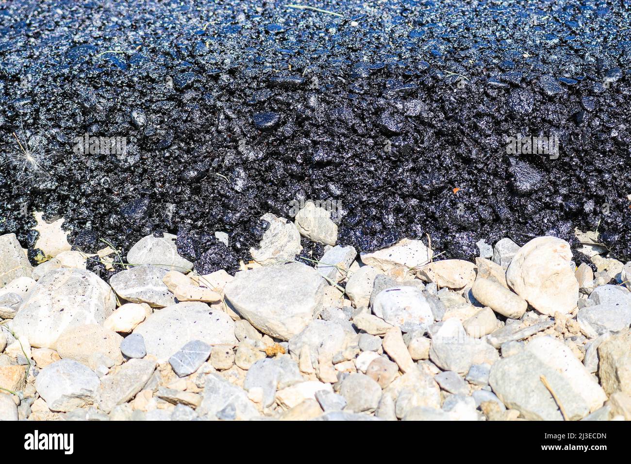 New layer of asphalt road under construction Stock Photo - Alamy
