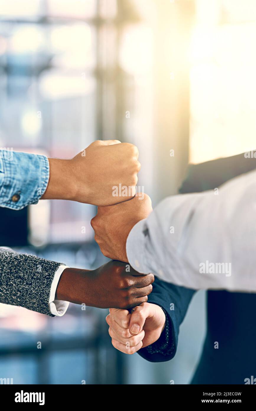 Supporting one another. Cropped shot of a group of unrecognizable ...