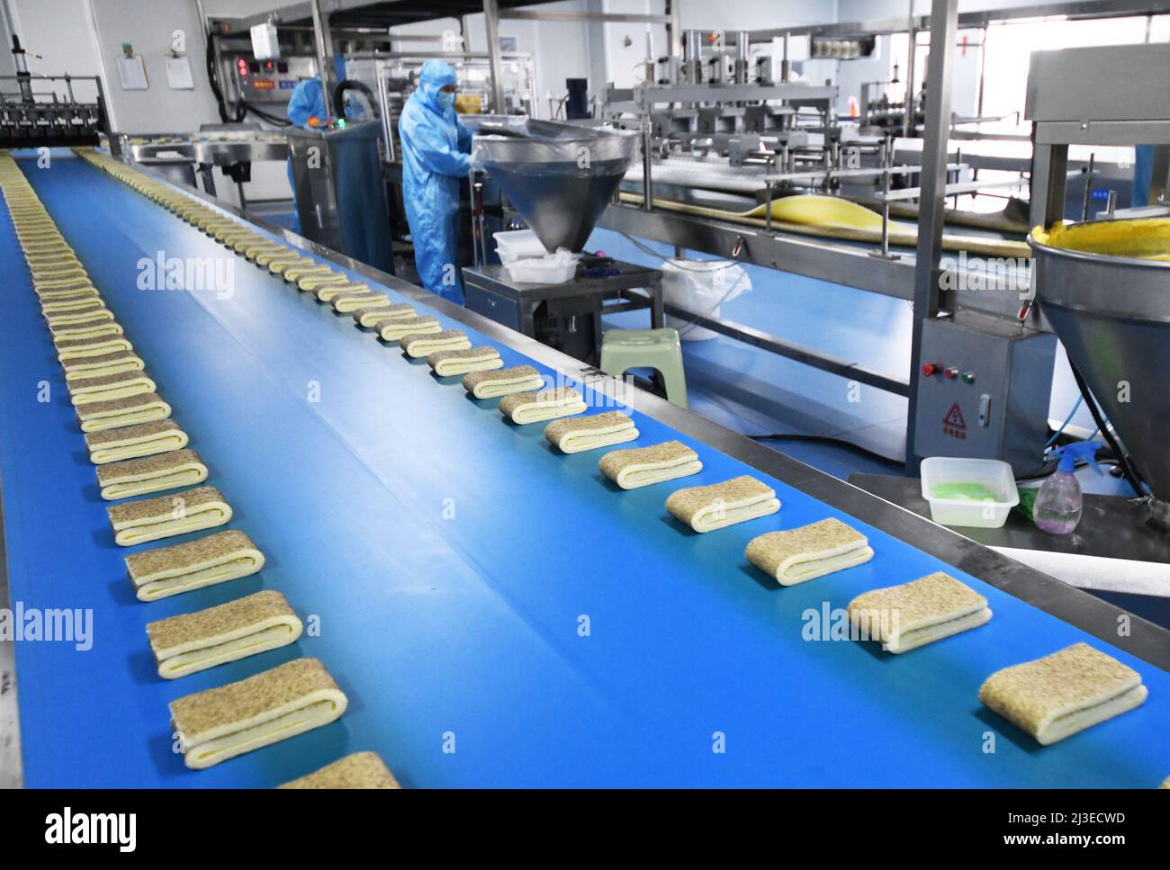 ZAOZHUANG, CHINA - APRIL 7, 2022 - Workers work on a bread production ...