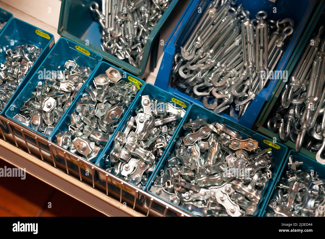 Boxes with building hardware in a hardware store Stock Photo - Alamy