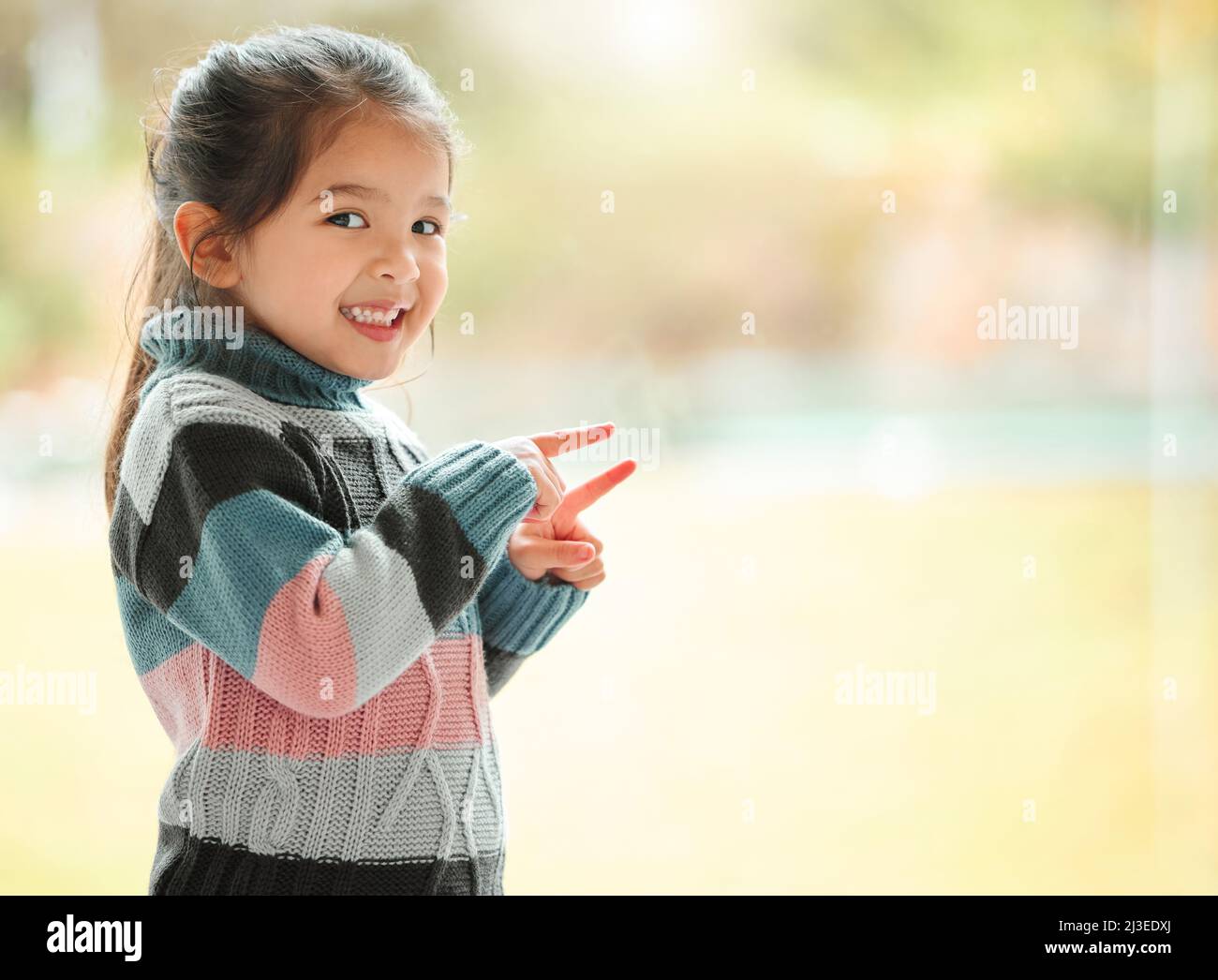 I want to go outside. Shot of an adorable little girl at home Stock ...