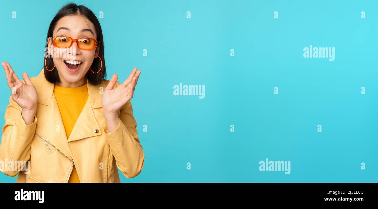 Image of enthusiastic young asian woman celebrating, triumphing ...