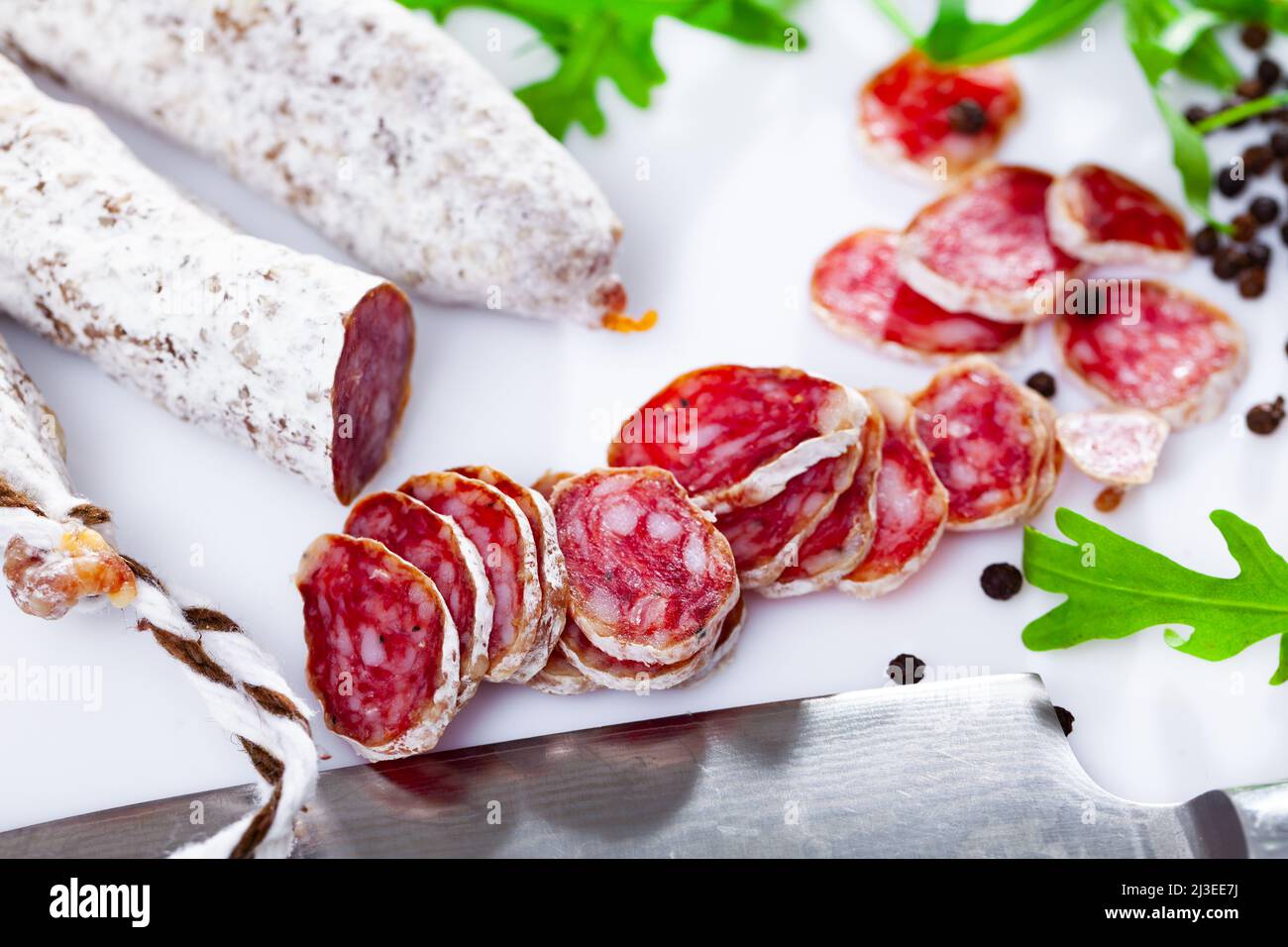 Traditional spanish thin salami sausage Fuet, sliced Stock Photo - Alamy