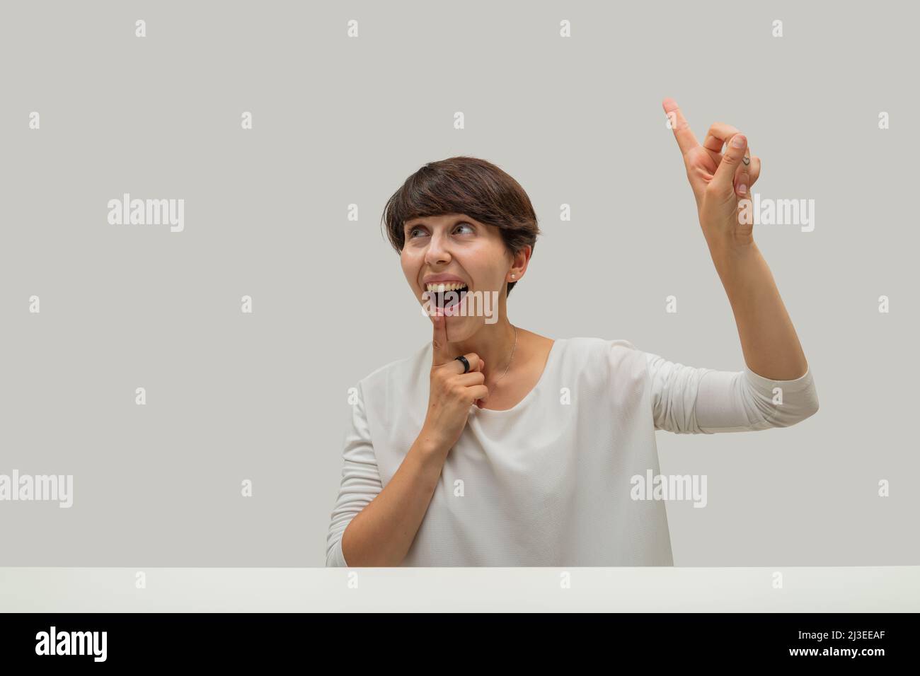 Silly and funny expression of a woman who has a great idea or solution ...