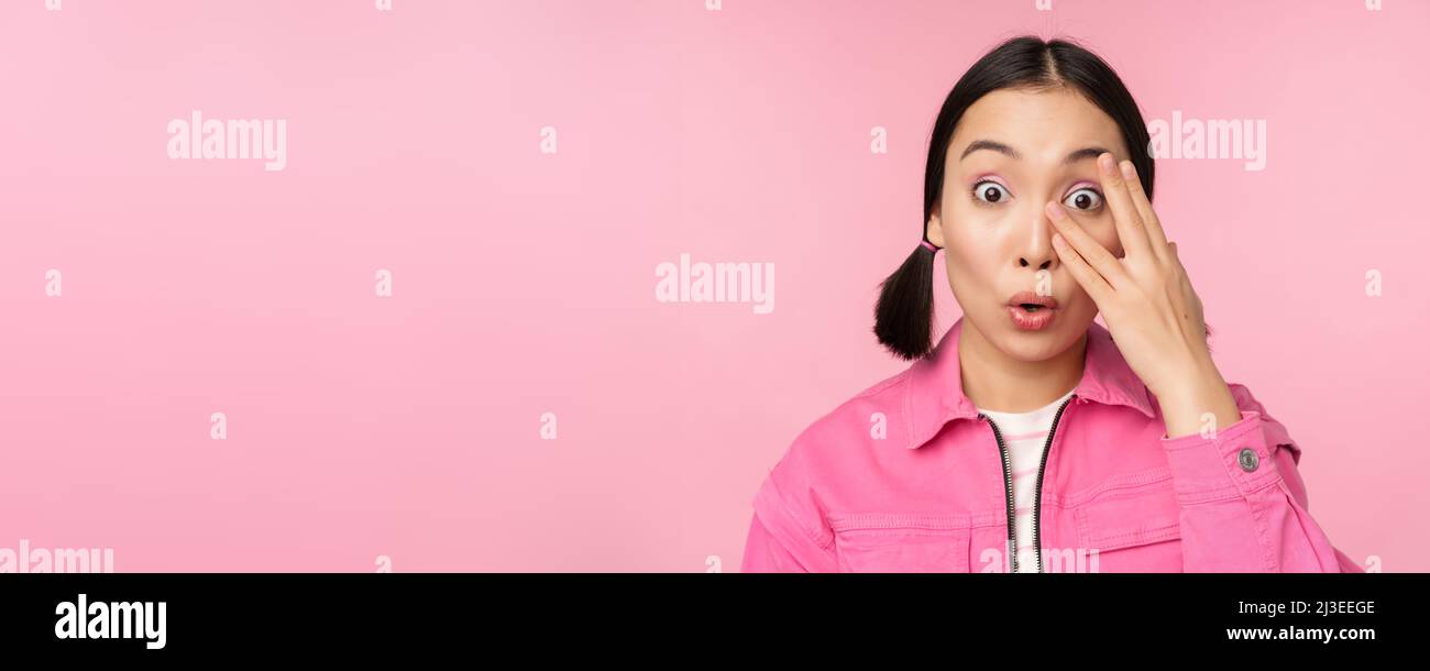 Close Up Portrait Of Young Asian Girl Looking Surprised Express