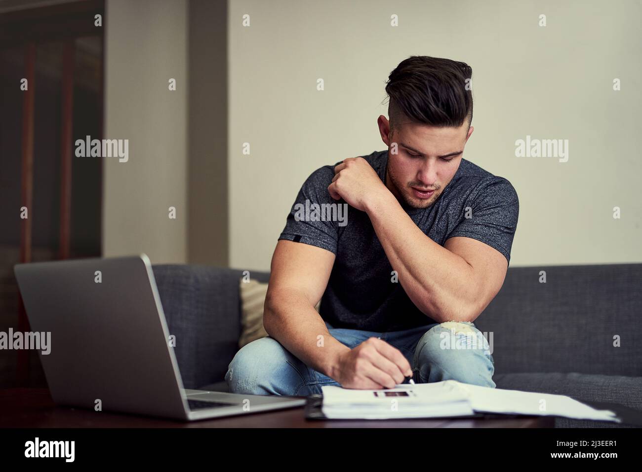 Working hard to distinguish himself from the rest. Shot of a driven ...