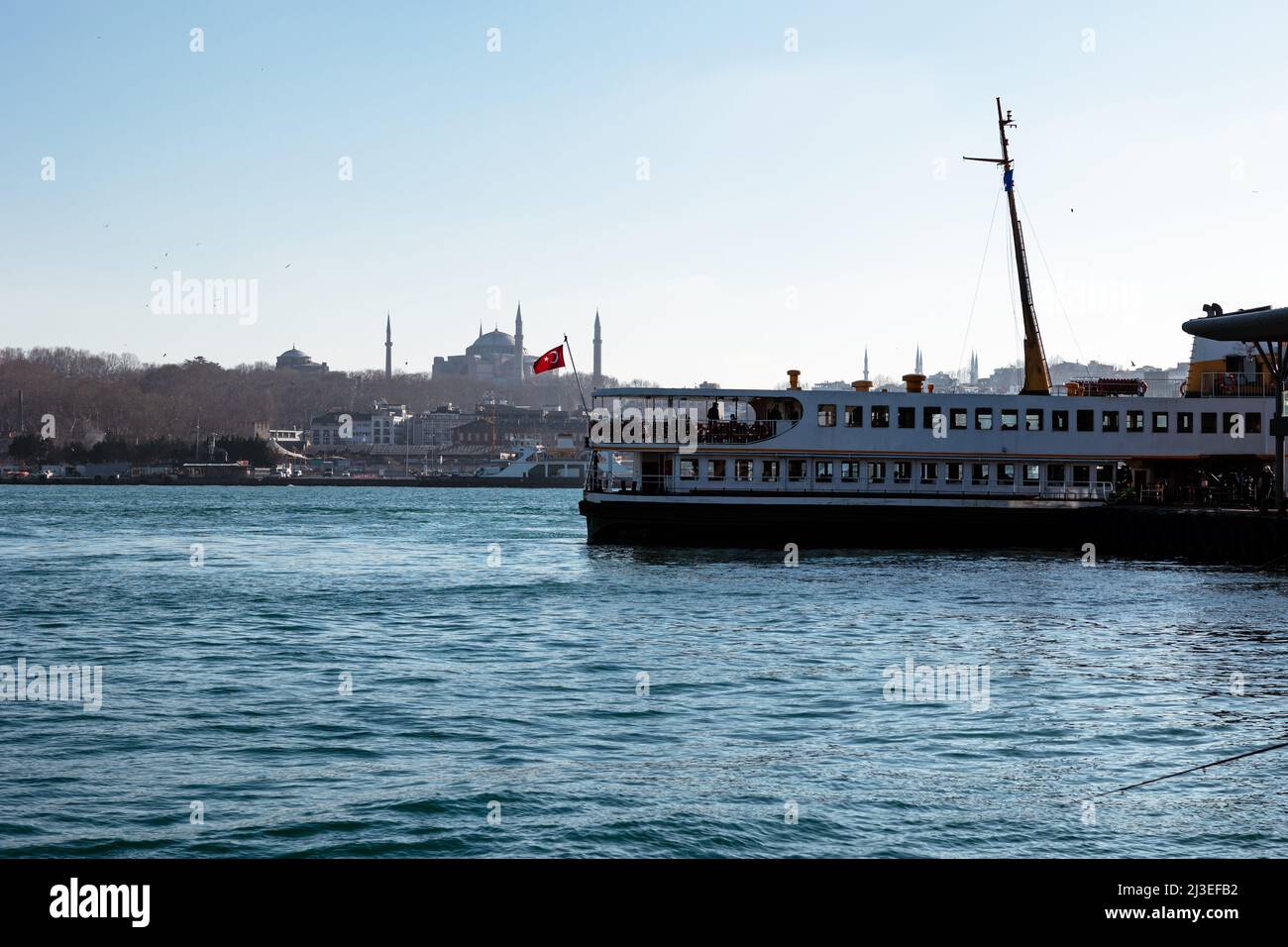 Famous ferries of Istanbul and Hagia Sophia on the background. Travel ...