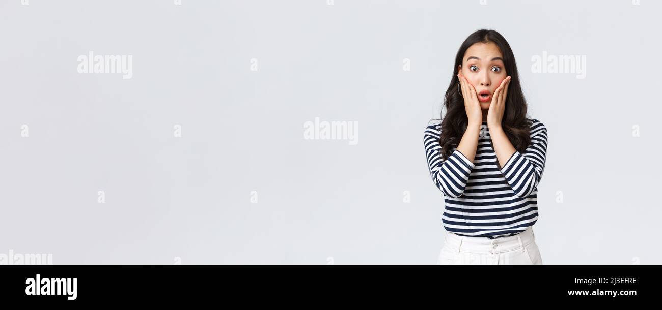 Lifestyle, people emotions and casual concept. Surprised gasping woman ...