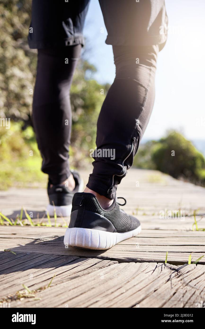 Its all about taking that first step. Cropped shot of an unrecognizable ...