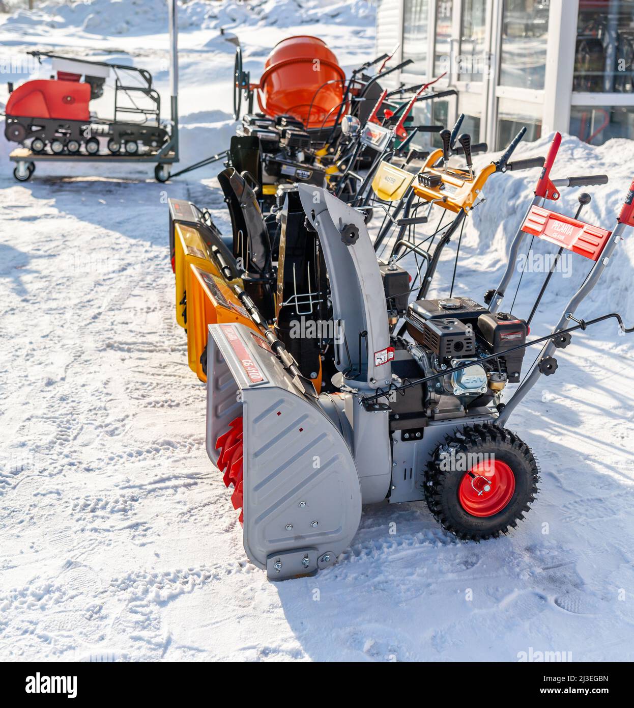 A new petrol snowplow is on sale. Snow removal mechanism. A device for ...
