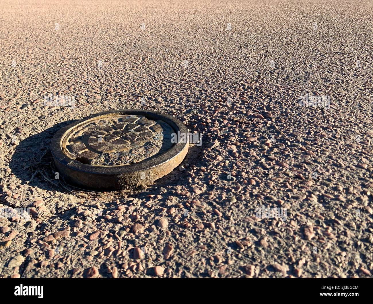 Low angle view of capped water main in residential street Stock Photo ...
