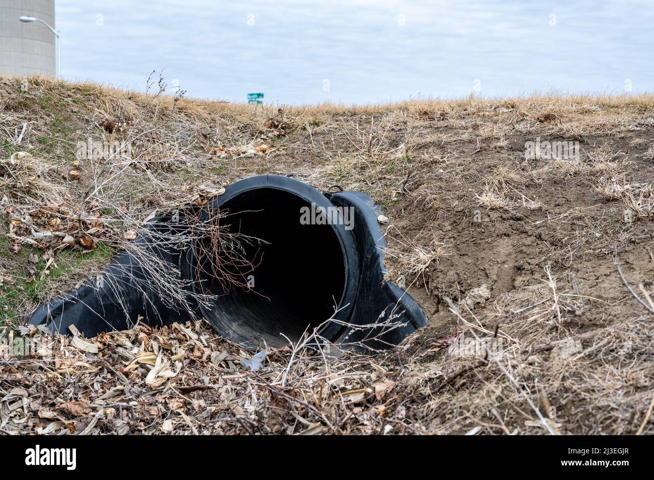 HDPE drainage culvert under a road entrance. Pipe is used to convey ...