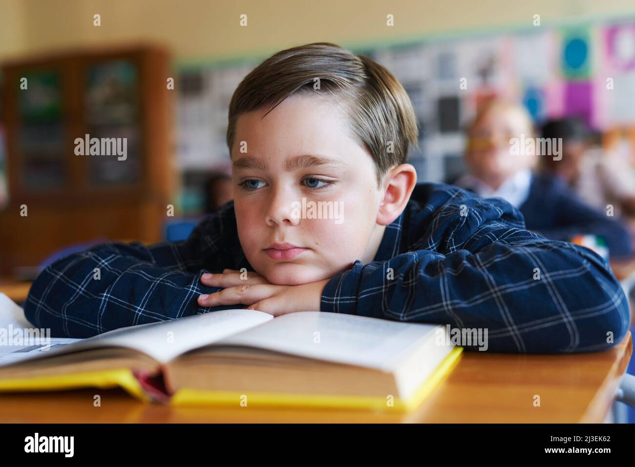 Student looking bored in classroom hi-res stock photography and images ...