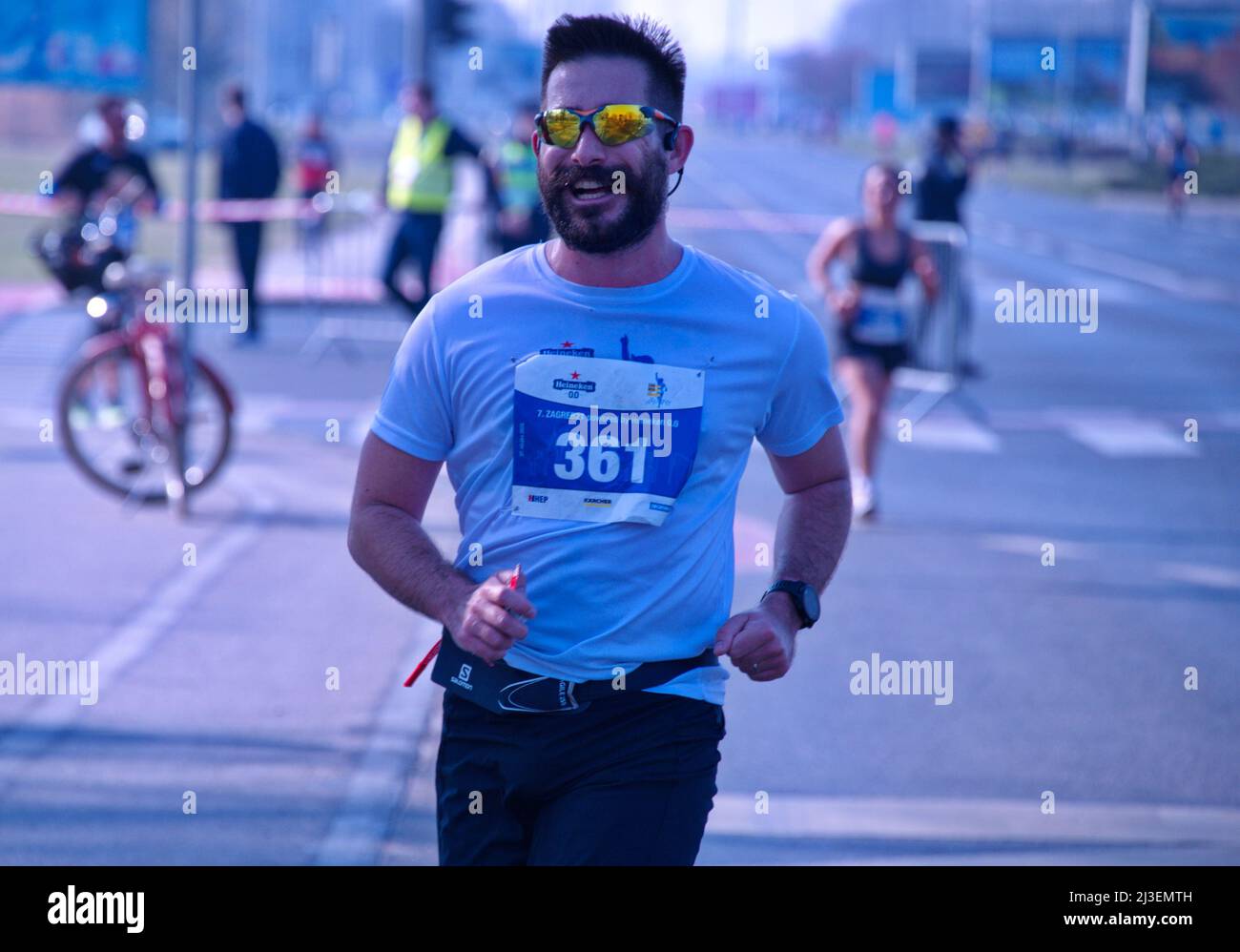 Mature man running marathon race Stock Photo - Alamy