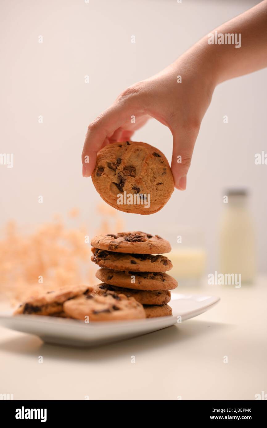 Female hand holding piece chocolate hi-res stock photography and images ...