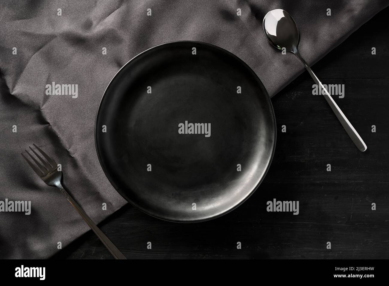 Overhead shot, Modern black dining table setting with empty black ...