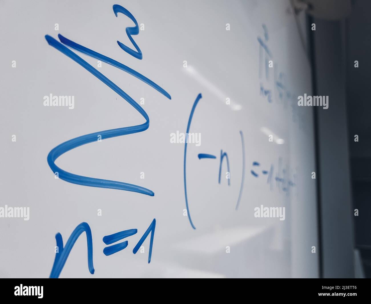 mathematical symbols of an equation from a mathematics lecture on a ...