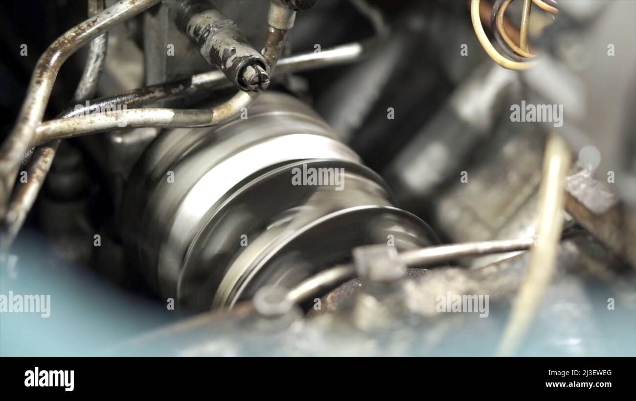 Close-up of rotating part of generator. Clip. Cylindrical part of ...