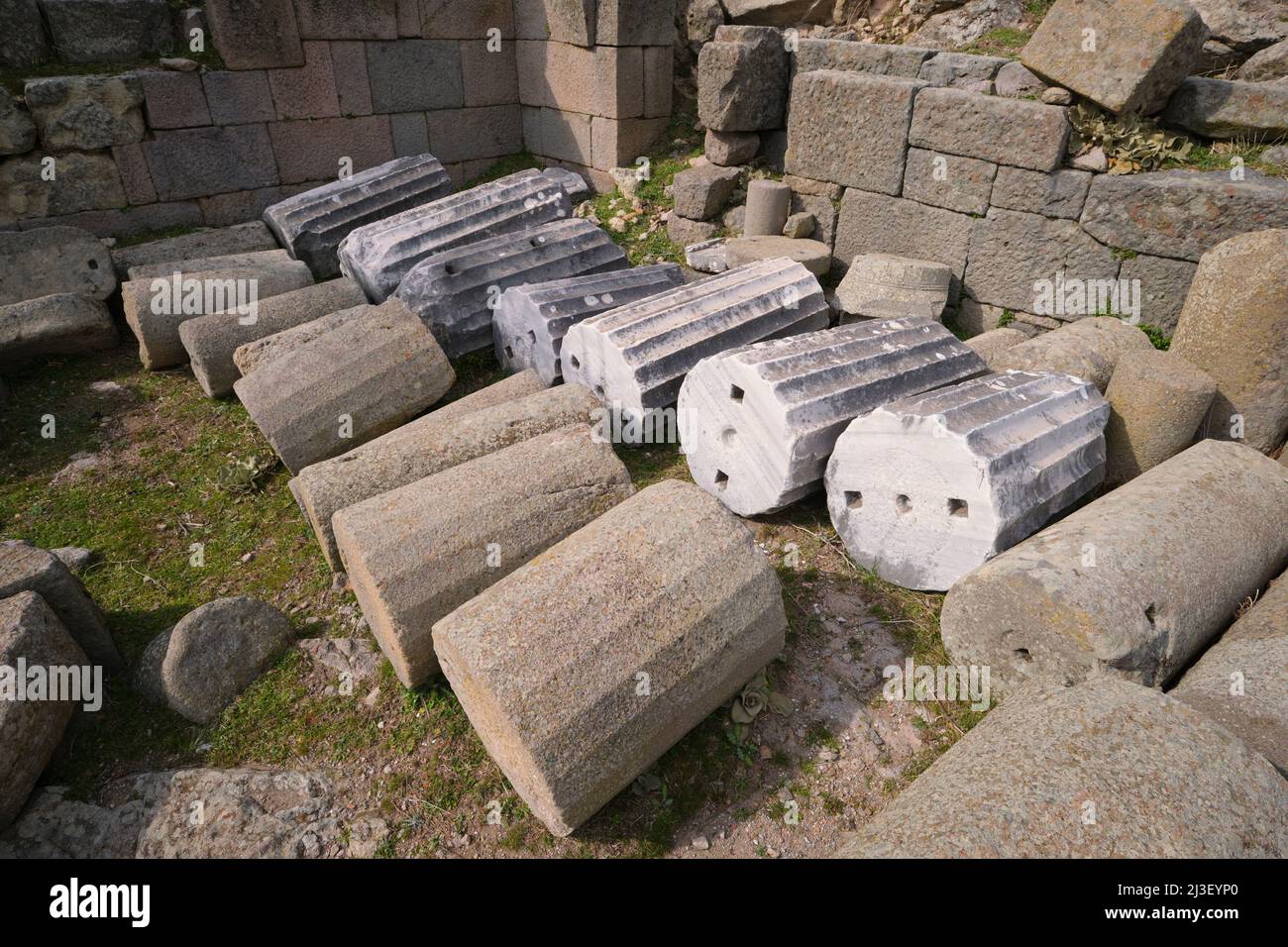 Stone and marble column sections, sorted and laying on the ground at ...