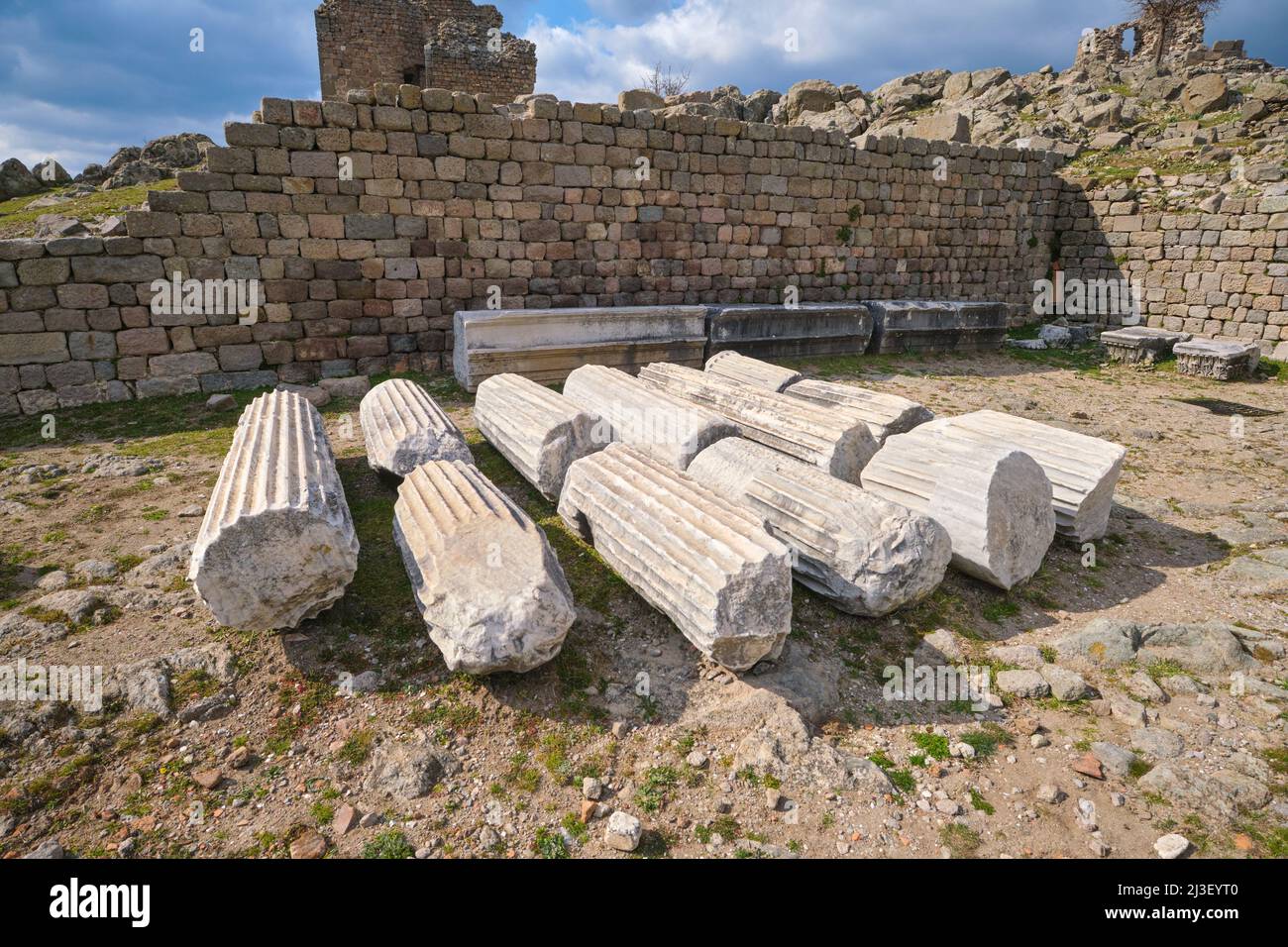 Stone and marble column sections, sorted and laying on the ground at ...