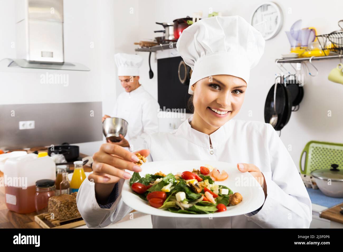 Smiling female chef salad hi-res stock photography and images - Alamy