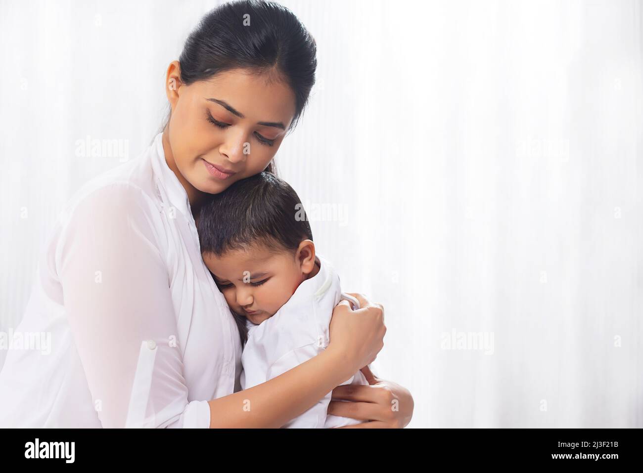 Mother hugging her little baby with affection Stock Photo - Alamy