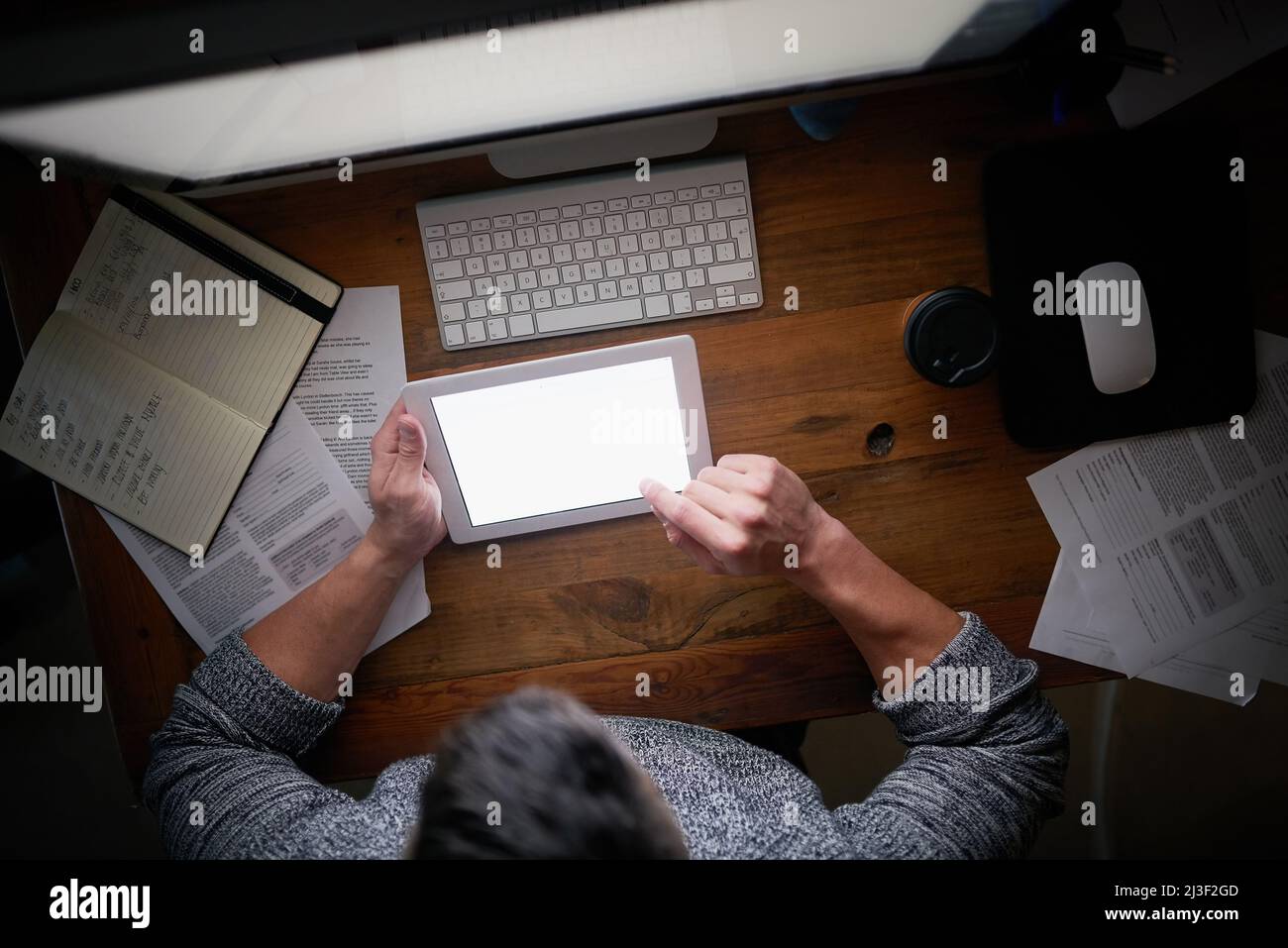 When youre chasing success, you forget the time. High angle shot of an unidentifiable computer ...