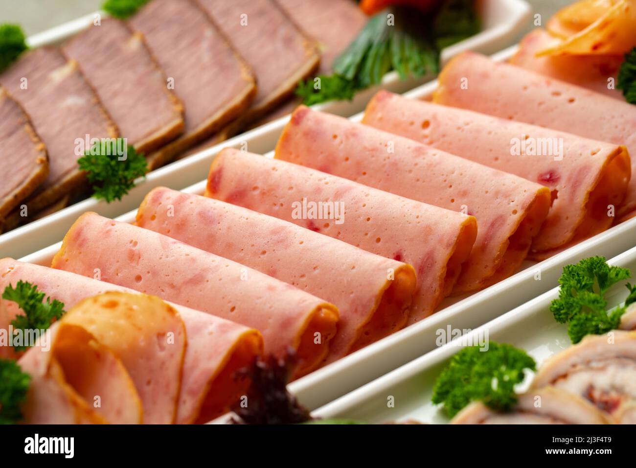Platter of fresh meat cold cuts with vegetables Stock Photo - Alamy