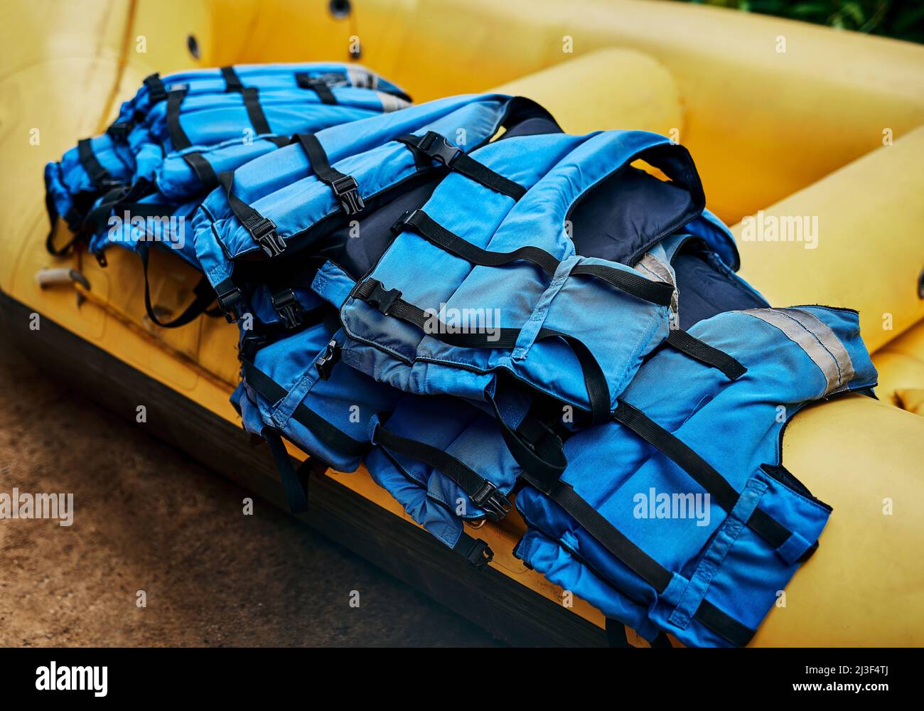 These guys can save your life. Shot of a pile of river rafting life ...