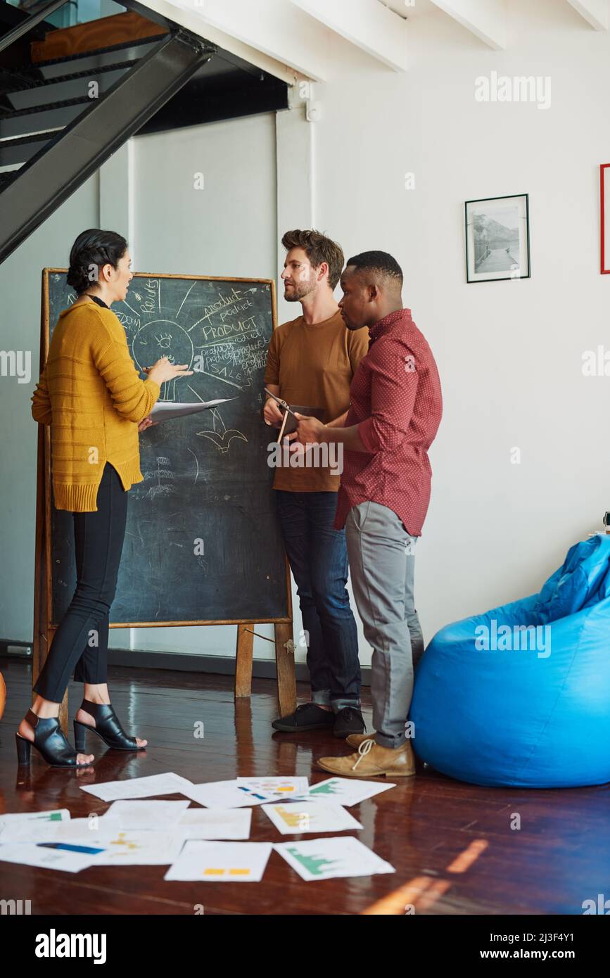 Building on each others ideas. Shot of a group of creative workers ...