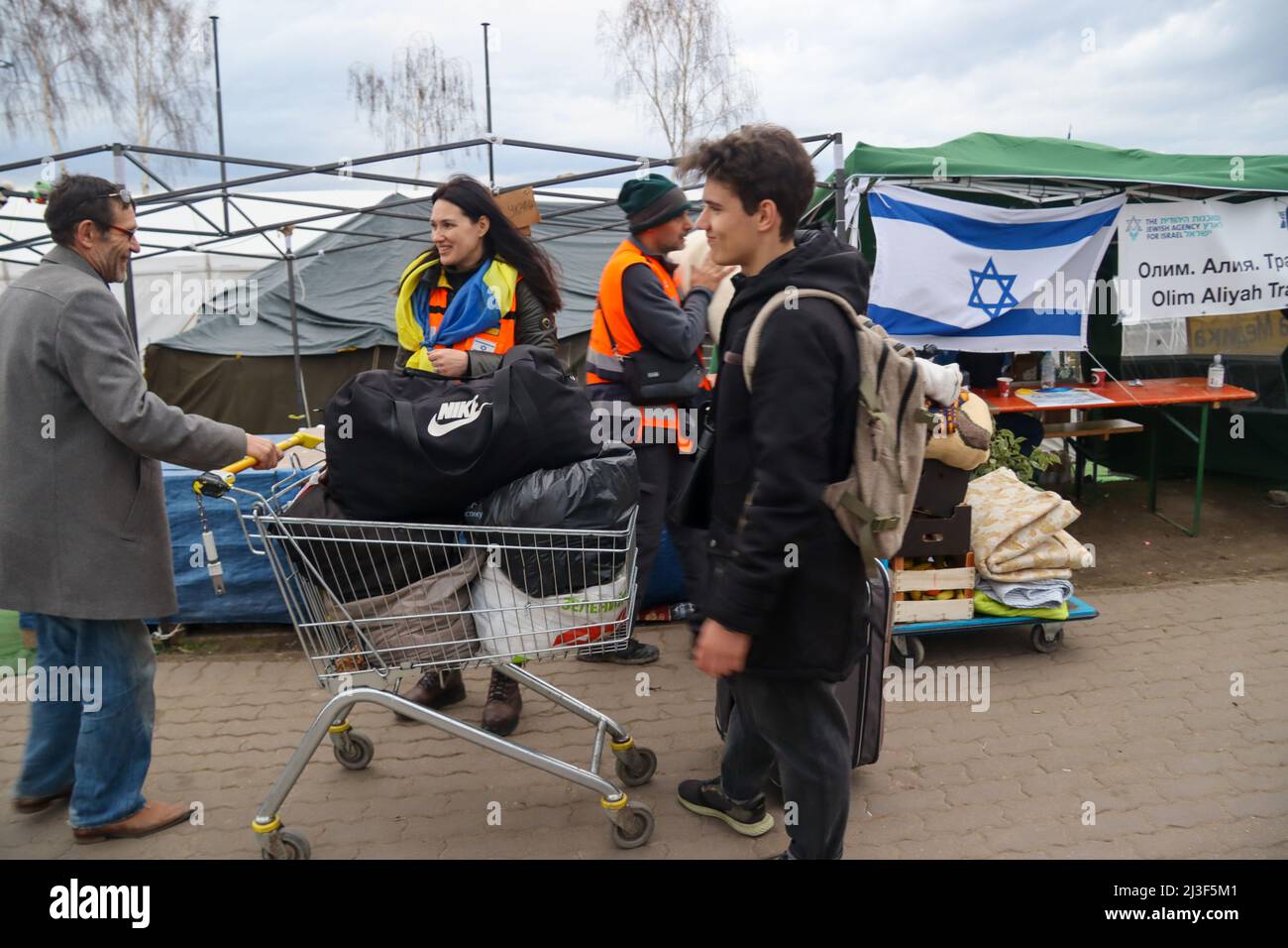 Medyka, Poland. 6th Apr, 2022. A Refugee man and his son uses a ...