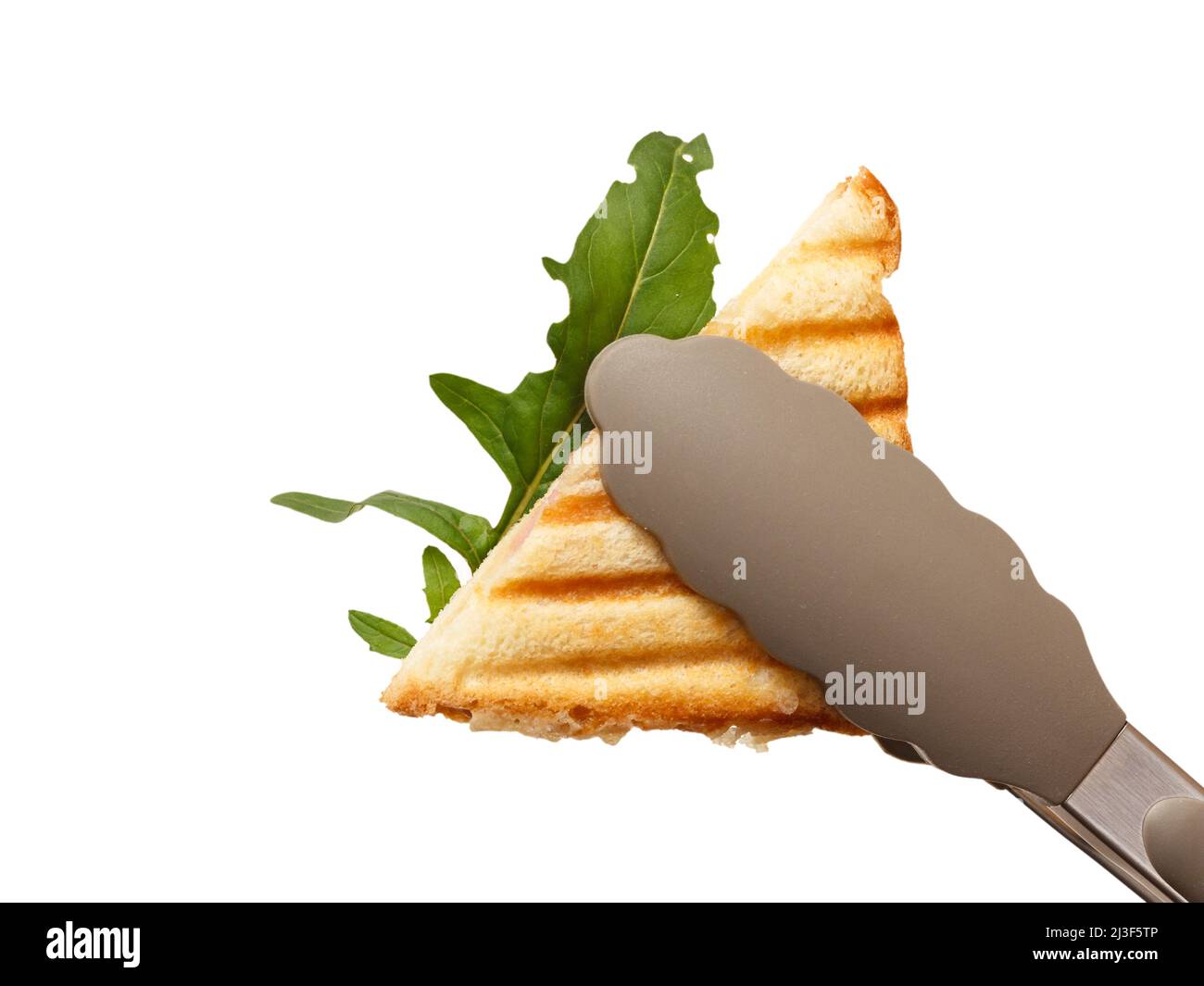 Kitchen tongs with a grilled cheese sandwich for breakfast on the white ...