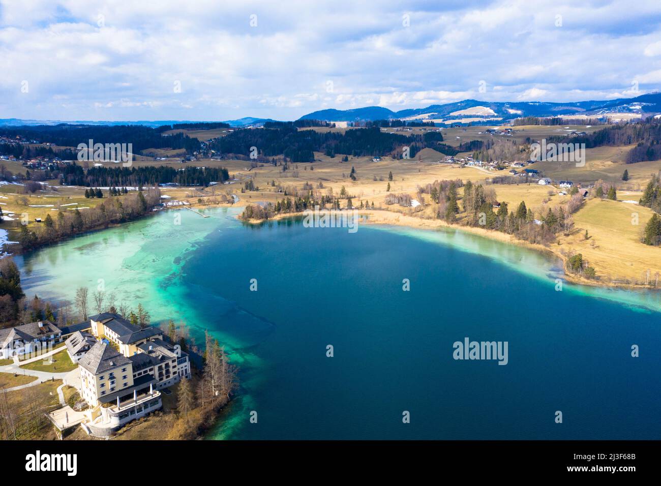 Drone photography from castle Fuschl on the shore of mountain lake ...