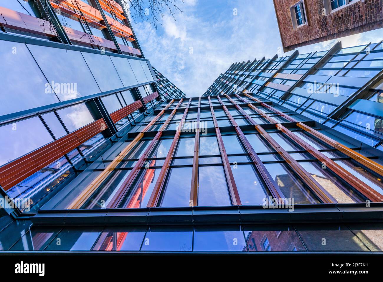 Upward view of skyscrapers with reflections in windows, London, UK ...