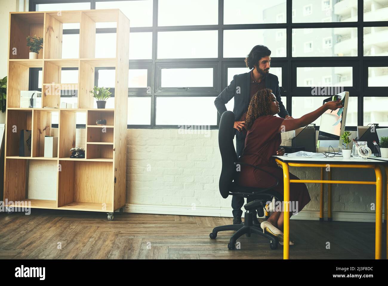 Helping coworker office hi-res stock photography and images - Alamy