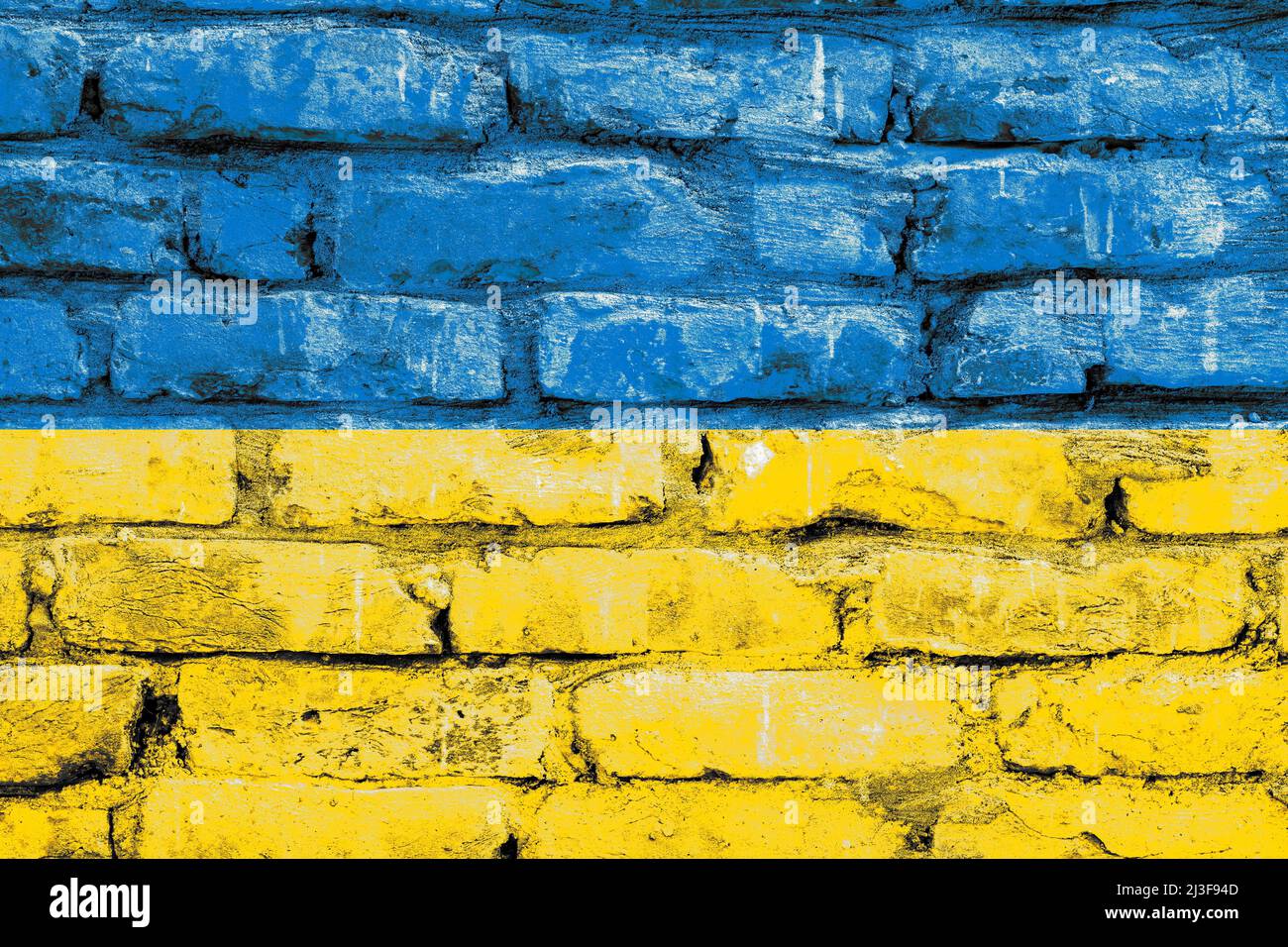 Distressed painted ukrainian flag on a brick structural old concrete ...