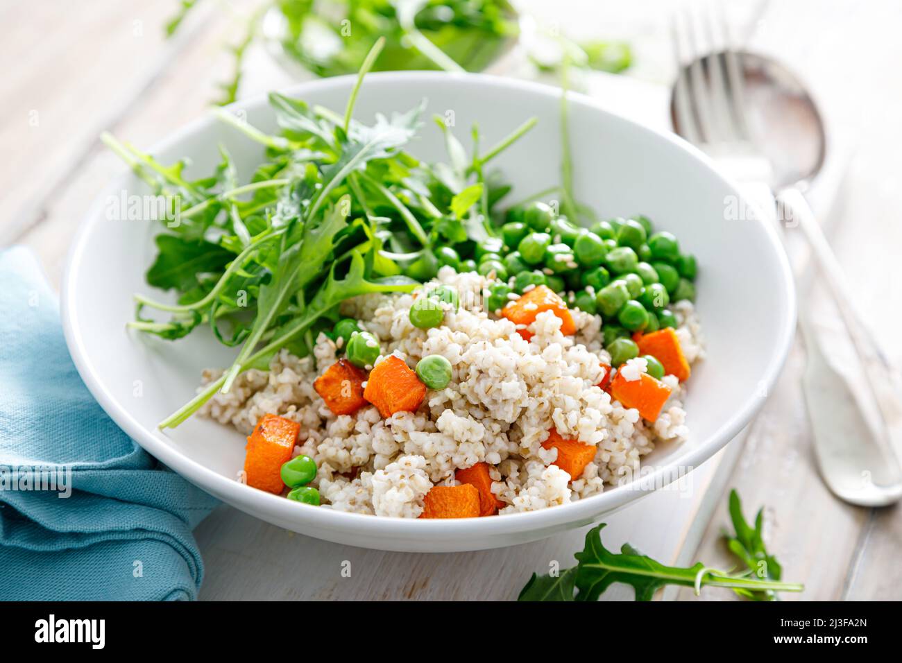 Barley porridge with green peas, baked pumpkin and fresh arugula salad ...