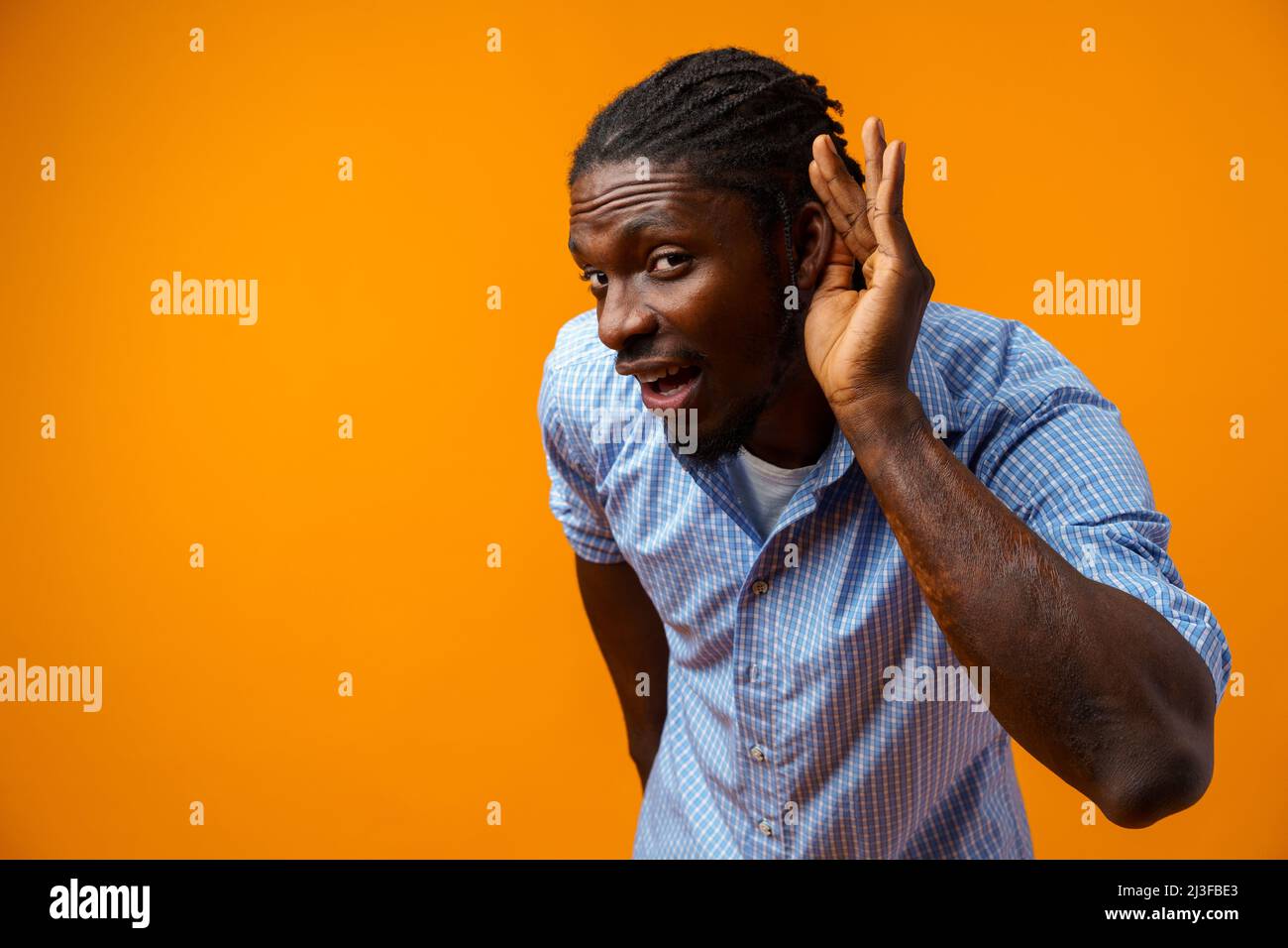 Hand behind ear listening hi-res stock photography and images - Alamy