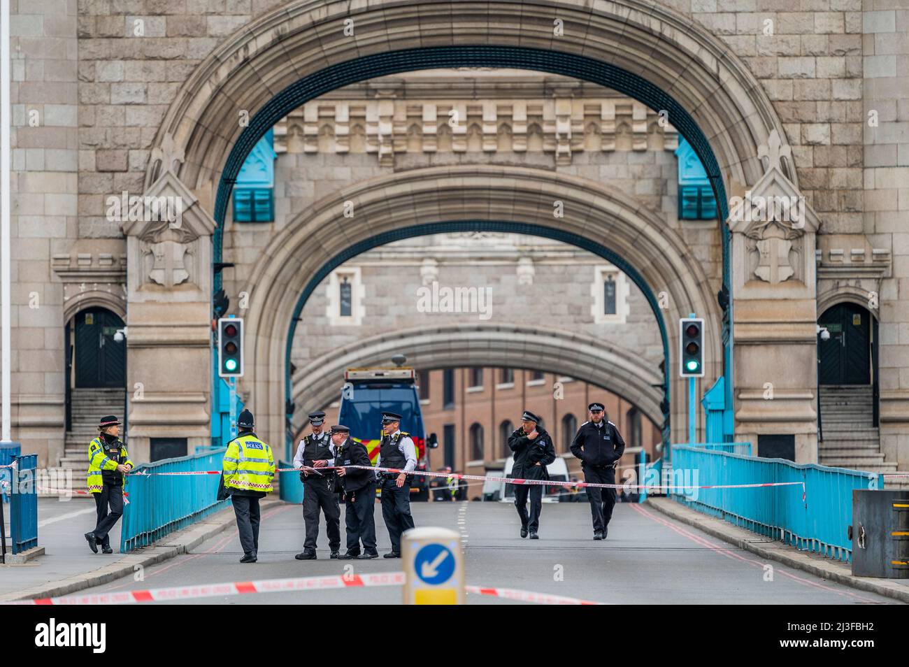 London, UK. 8th Apr, 2022. Police seal off the bridge while they work ...