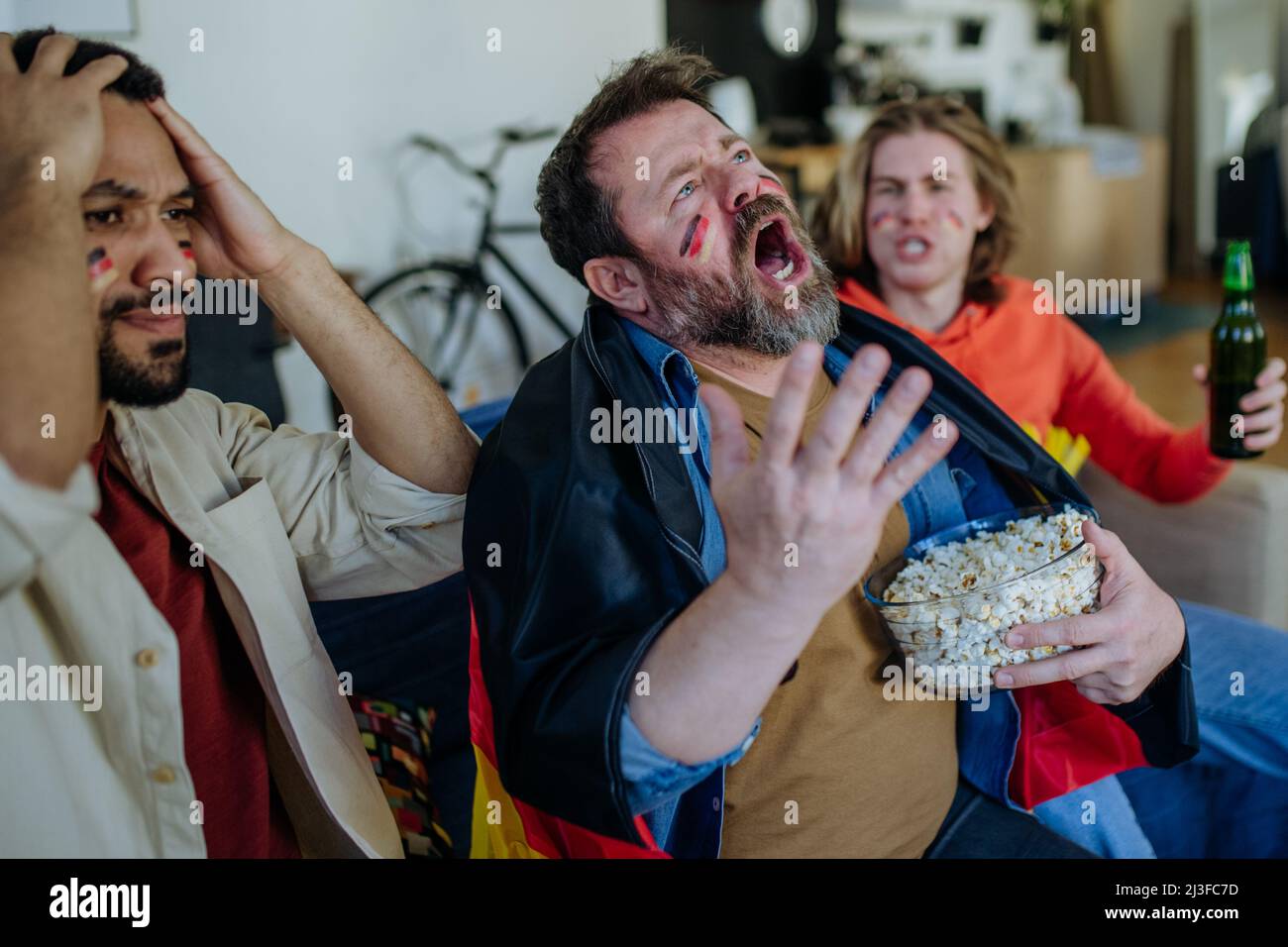 Nervous football fans friends watching German national team in live ...