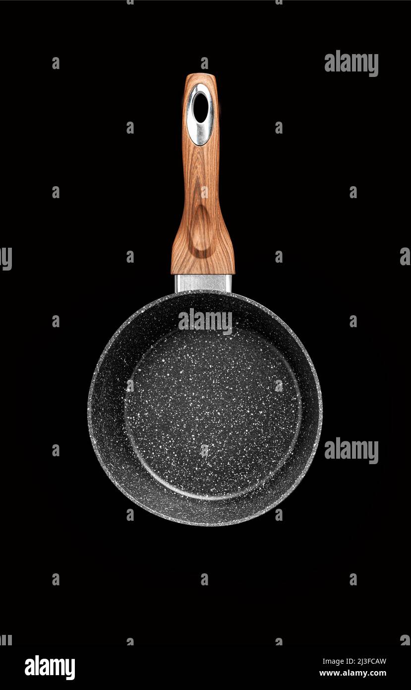 Modern frying pan with non-stick granite coating isolated on black ...
