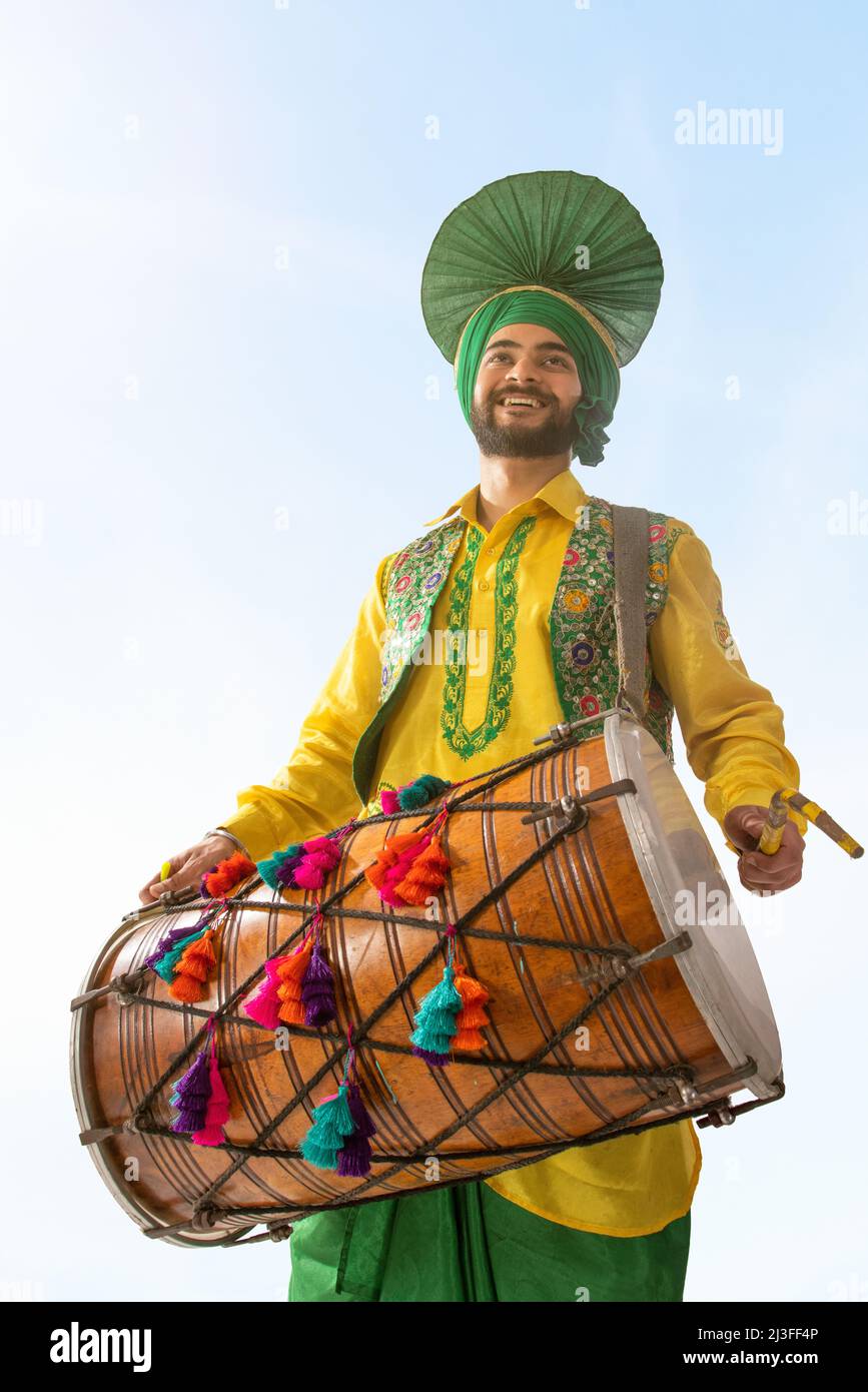Portrait of Sikh man playing drum during Baisakhi celebration Stock ...