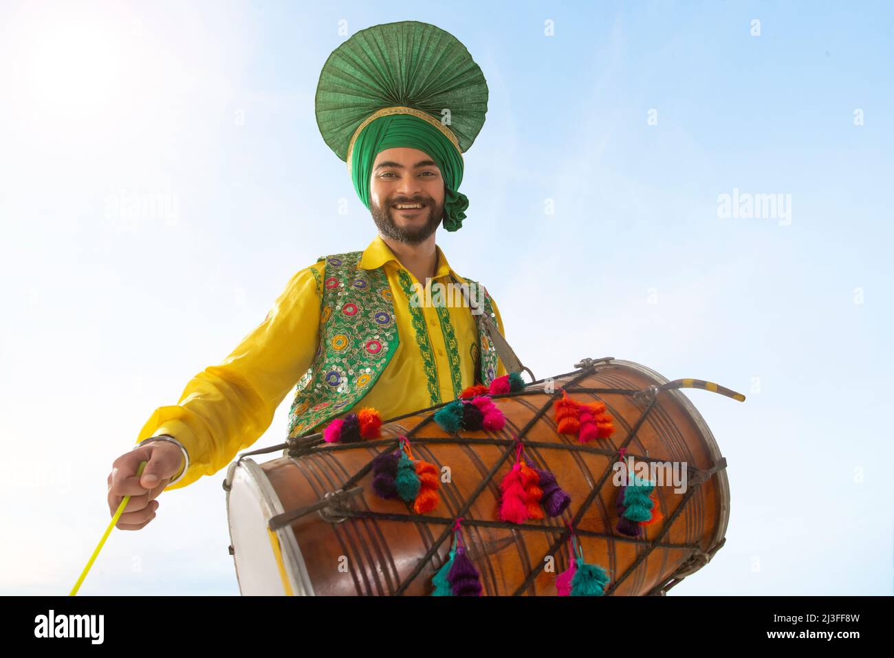 Portrait of Sikh man playing drum during Baisakhi celebration Stock ...