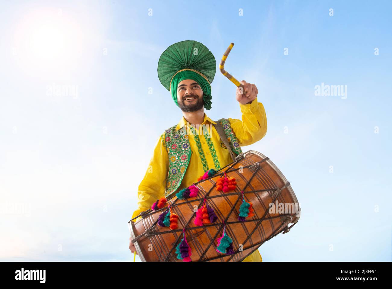 Portrait of Sikh man playing drum during Baisakhi celebration Stock ...